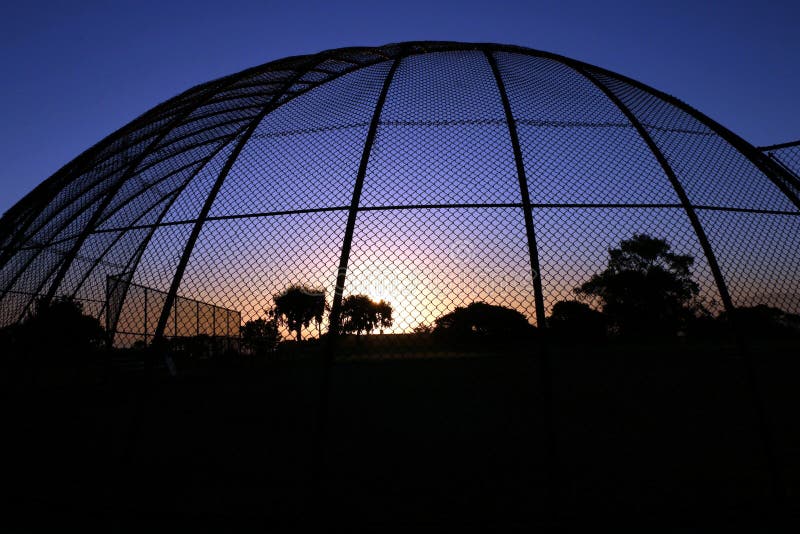 Baseball Backstop is Silhouetted Against a Deep Blue Sky at Sunrise ...
