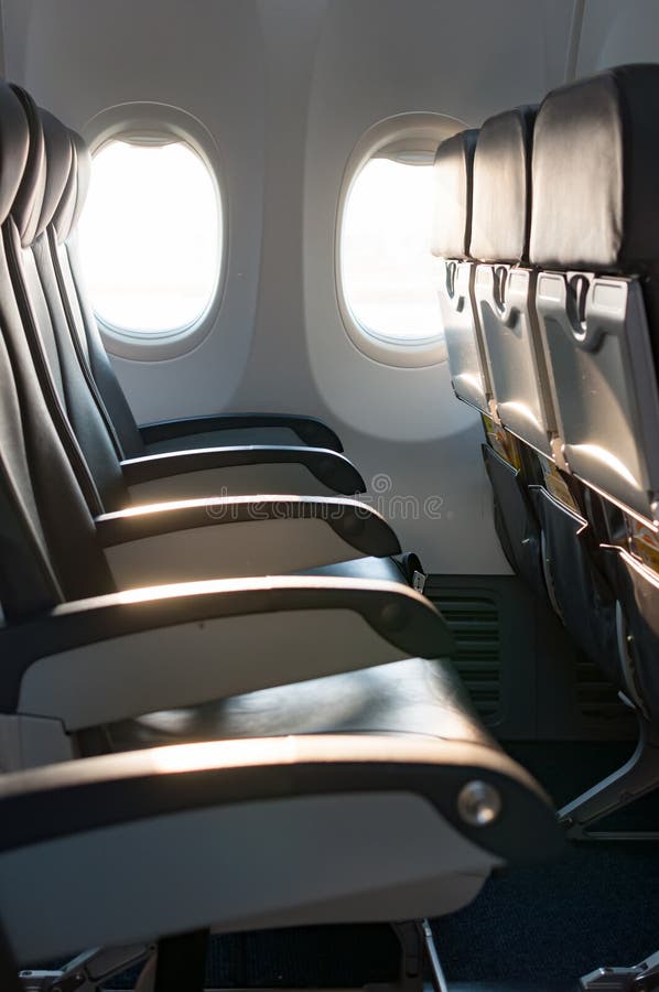 Empty Airplane Seats in the Cabin in the Morning Flight Stock Photo ...