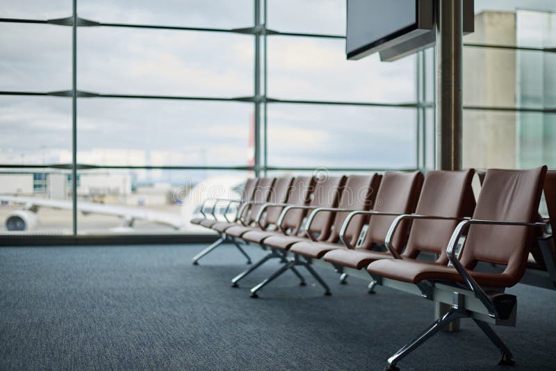 Empty Airport with Blurred Plane on a Background Stock Photo - Image of ...