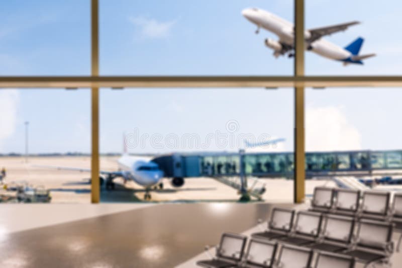 Empty Airport Terminal Hall with an Airplane in the Background Stock ...