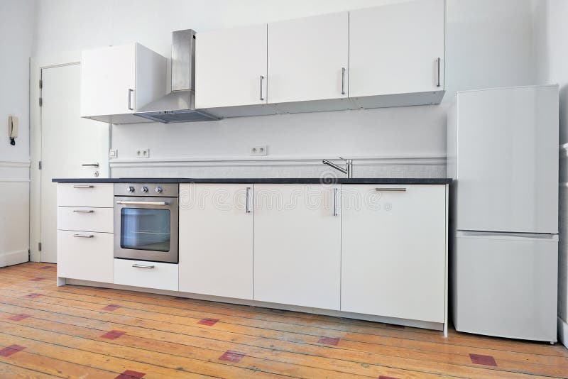 Empty Apartment with Modern Kitchen and Designed Hardwood Floor Stock ...