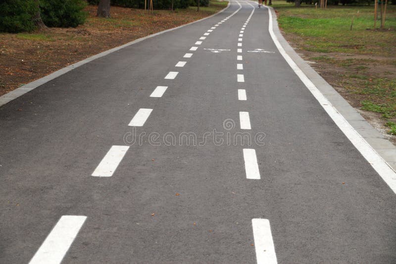 Empty asphalt bike path stock photo. Image of cyclist - 154527034