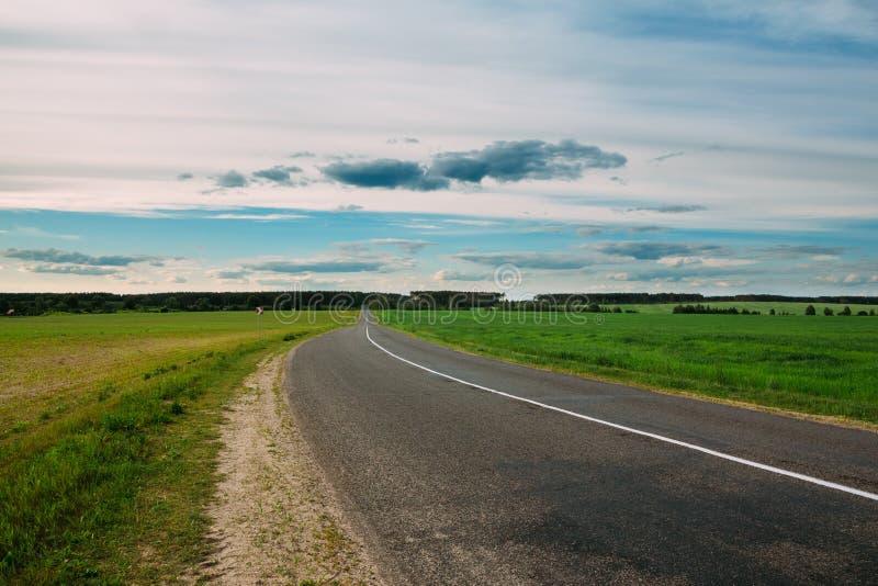 Landscape with Asphalt Road and Open Fields Stock Photo - Image of ...