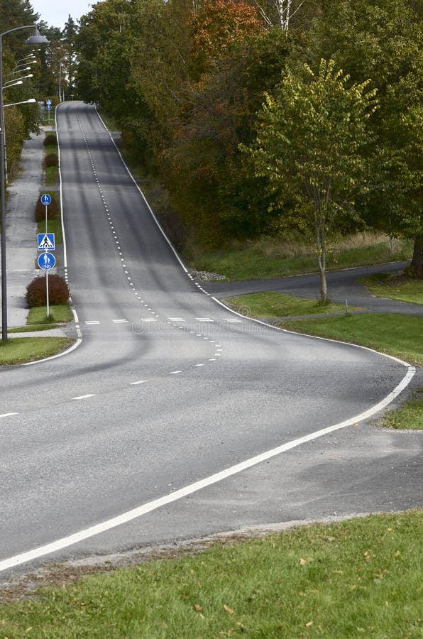 Empty Asphalt Road with a Steep Climb Stock Image - Image of road, sign ...