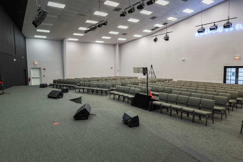Empty Auditorium with Gray Chairs and Stage Setup Stock Photo - Image ...