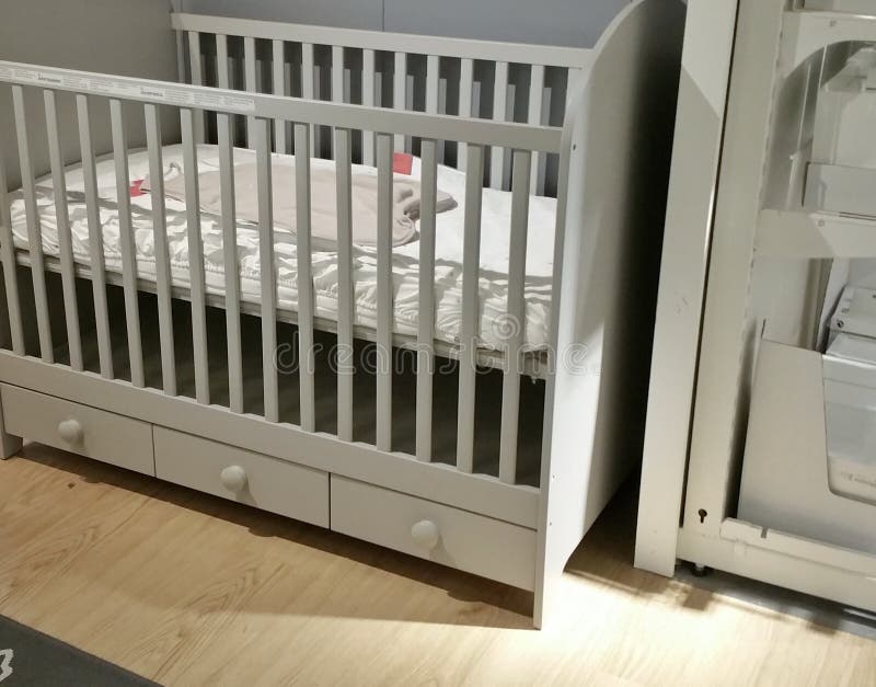 Empty Crib With Pillow And Price Slip Label Stock Photo - Image of ...