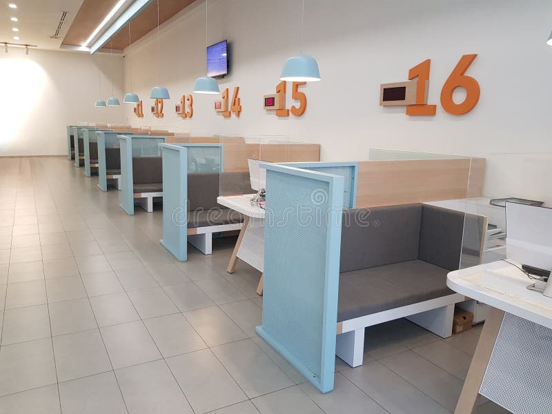 Empty Bank Countier with Sofa and Cabine Numbers Stock Image - Image of ...