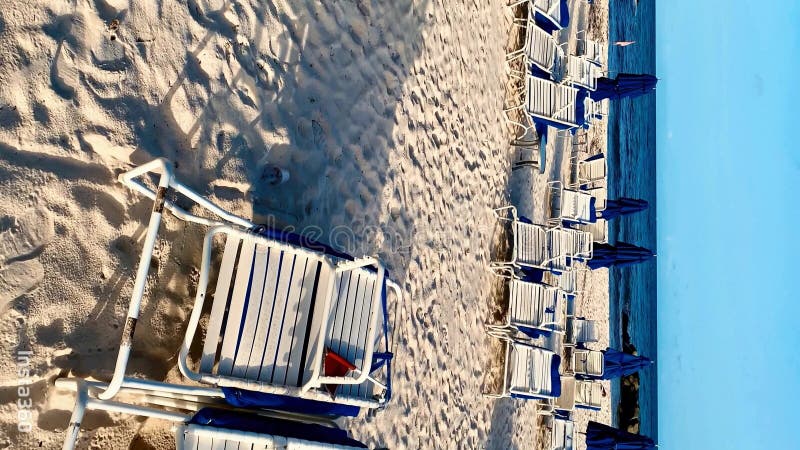 An almost Empty Beach at Sunset with Soft Waves Breaking Up a ...