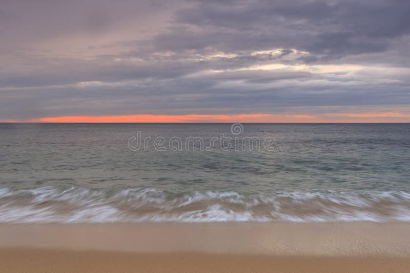 Empty beach at sunset stock photo. Image of cloudy, beautiful - 186251720