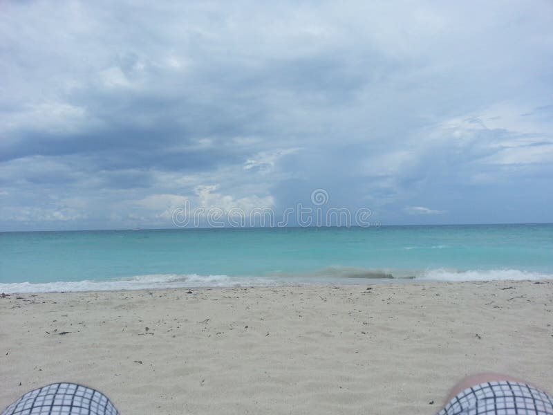Empty Beach Scene with Dark Clouds in Back Stock Photo - Image of ...