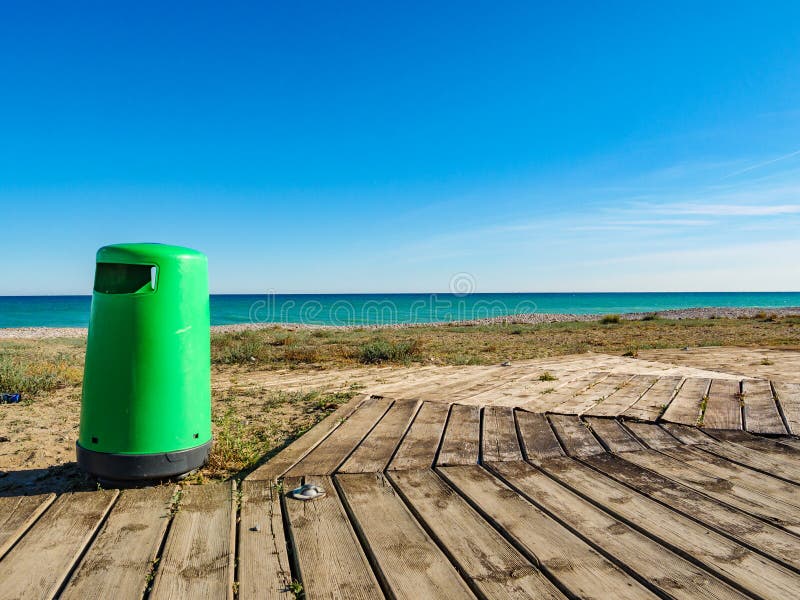 Empty beach with trash can stock image. Image of beach - 211666143