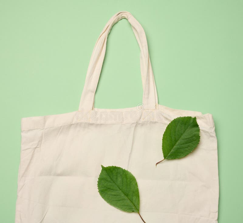 Empty Beige Textile Bag on Green Background, Rejection of Plastic Bags ...