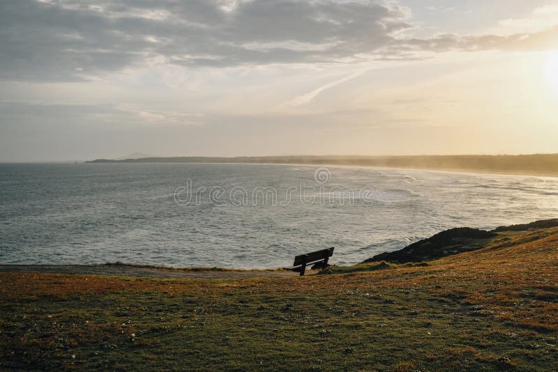 Bench and Sunset Over the Sea Stock Photo - Image of moon, coast: 279293254