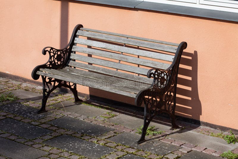 Empty Bench in Front of Orange Wall Stock Photo - Image of object, home ...