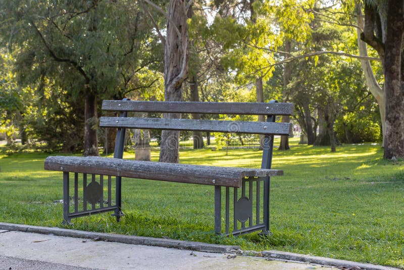An Empty Bench in a Green Park by Walking Path Stock Image - Image of ...