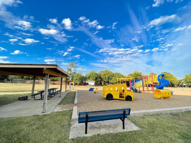 Empty Bench Near Colorful Typical Playground Structure Under Sunny Blue ...