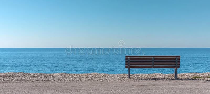 Empty Bench on a Pebble Beach with Blue Sky and Ocean Background ...