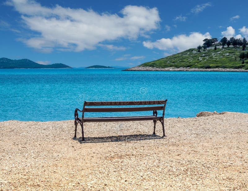 Empty Bench on the Shore of the Sea in Calm Cloudy Day Stock Image ...