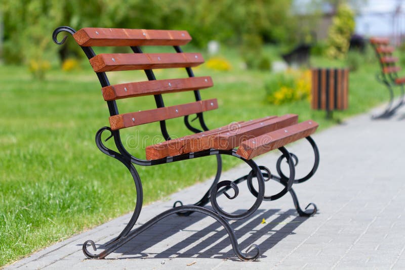 Empty bench in spring park stock photo. Image of tree - 182756270