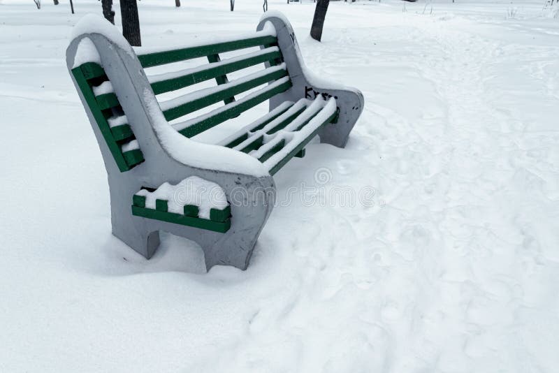 Empty Bench Under Snow in Winter Stock Photo - Image of snowfall, frost ...