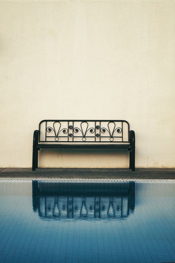 Empty Benches with Reflection Near the Swimming Pool Stock Photo ...