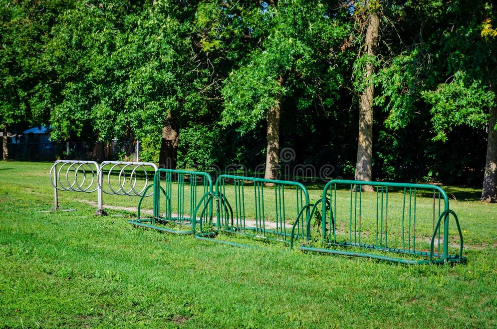 Empty Bicycle Racks in a Park Next To a Path Stock Image - Image of ...