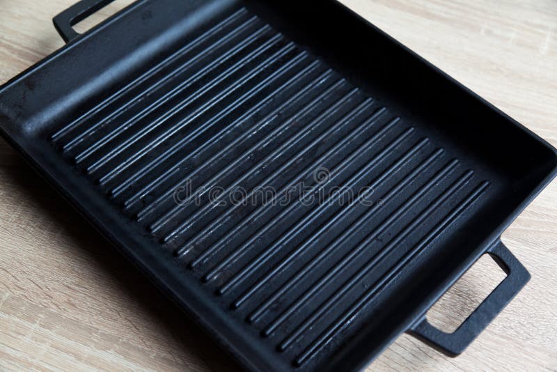Empty Black Cast Heavy Iron Grill Pan on Modern Oak Kitchen Countertop ...