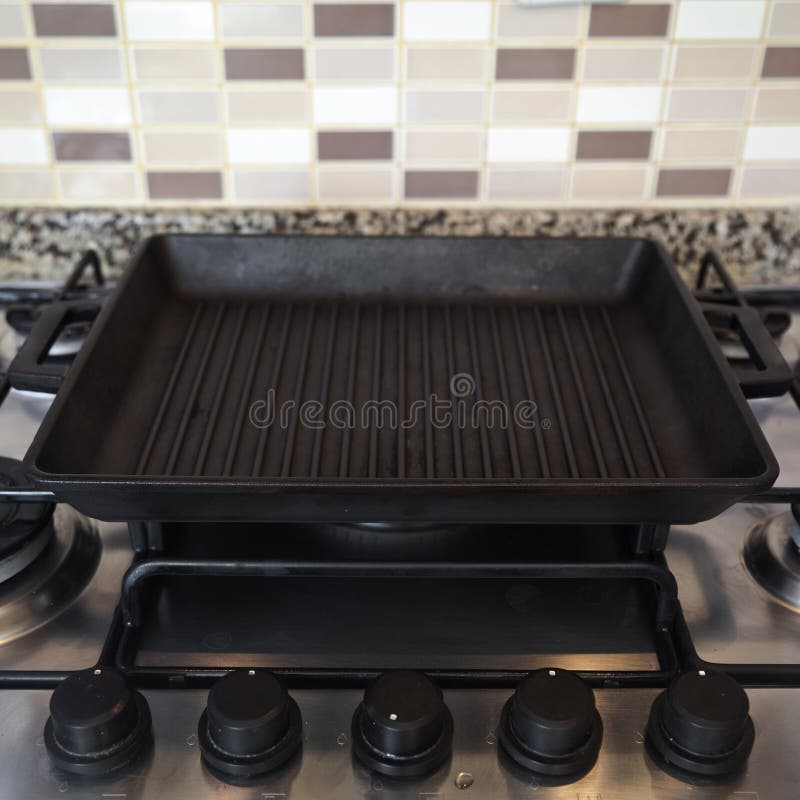 Empty Black Cast Iron Grill Pan on Gas Stove in a Modern Kitchen Stock ...