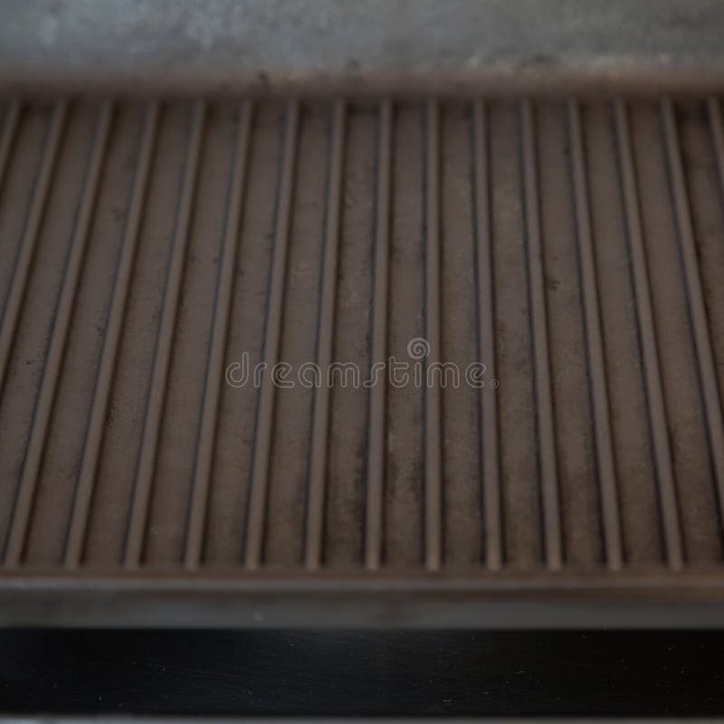Empty Black Cast Iron Grill Pan on Gas Stove in a Modern Kitchen Stock ...