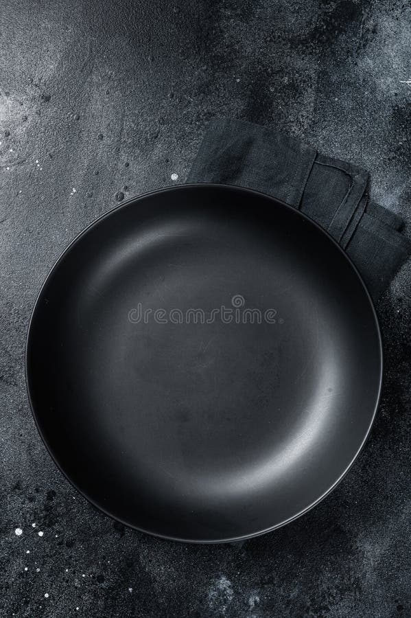 Empty Black Craft Plate on Table. Table Setting. Black Background. Top ...