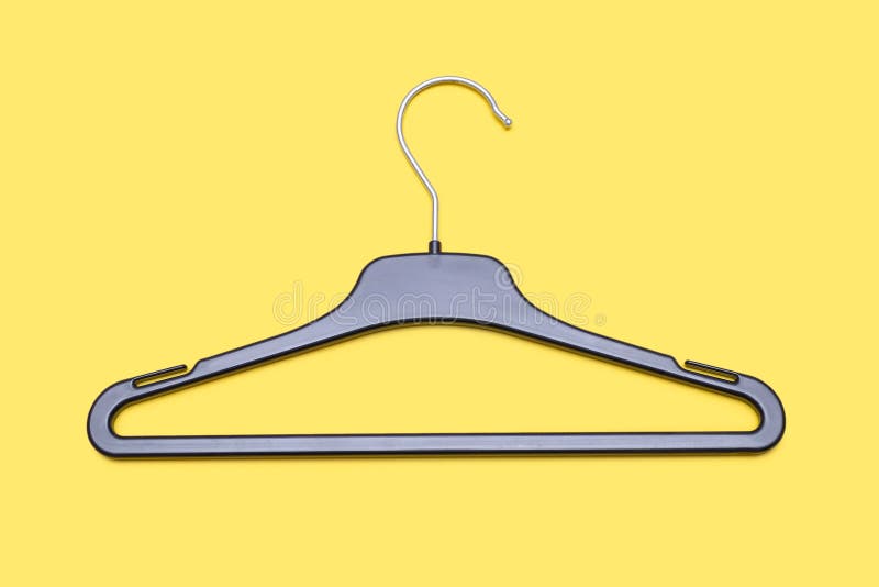 Empty Black Hanger Isolated on a Yellow Background Close Up Stock Photo ...