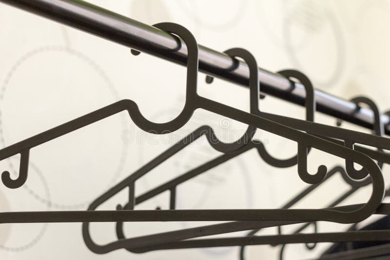 Empty Black Hangers Hang on a Hanger in the Room Stock Image - Image of ...