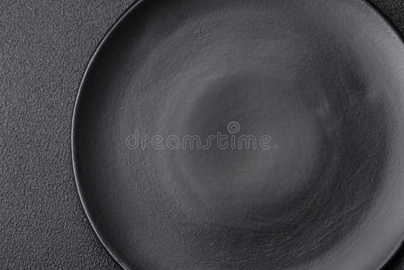 Empty Black Plate Over Dark Stone Background with Copy Space Stock ...