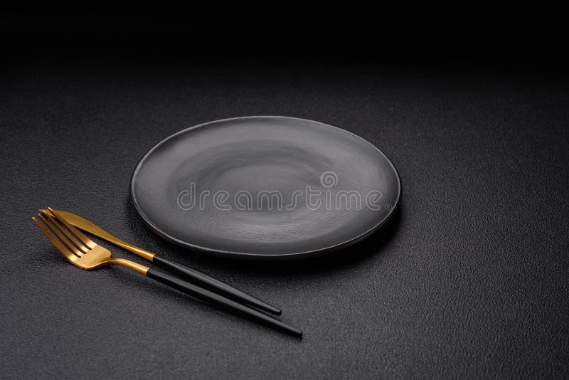Empty Black Plate Over Dark Stone Background with Copy Space Stock ...