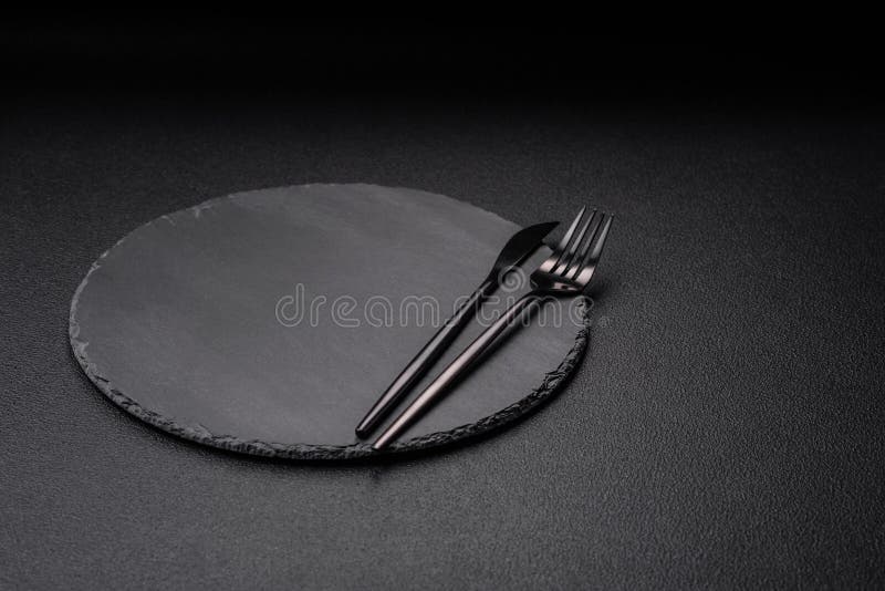 Empty Black Plate Over Dark Stone Background with Copy Space Stock ...