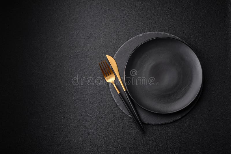 Empty Black Plate Over Dark Stone Background with Copy Space Stock ...