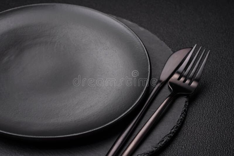 Empty Black Plate Over Dark Stone Background with Copy Space Stock ...