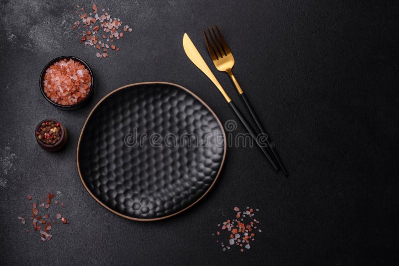 Empty Black Plate Over Dark Stone Background with Free Space Stock ...