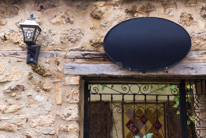 Empty Black Sign on Wall with Iron Windows Stock Photo - Image of ...