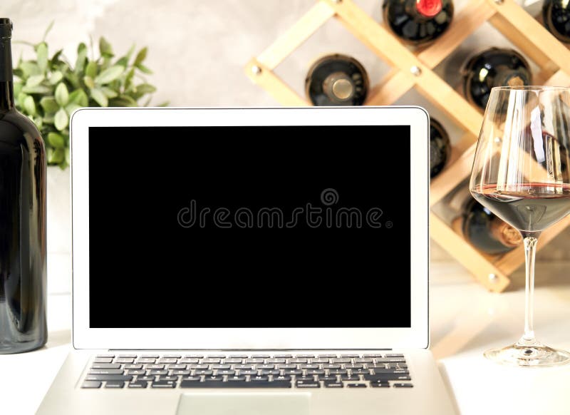 Empty Blank Screen Laptop Computer on Table with Wine Bottle Wine Rack ...
