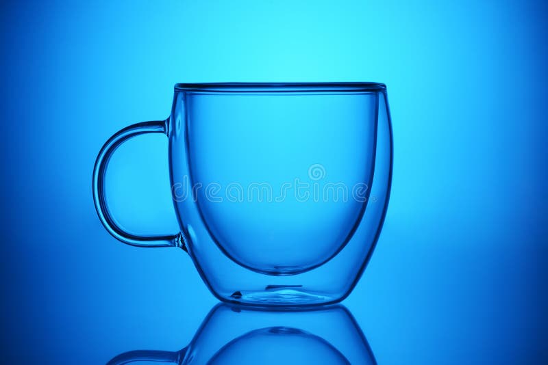 Transparent Cup on Blue Background Stock Image - Image of glass, blue ...
