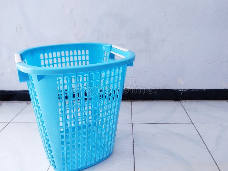 An Empty Blue Basket Laundry on White Floor Stock Image - Image of ...