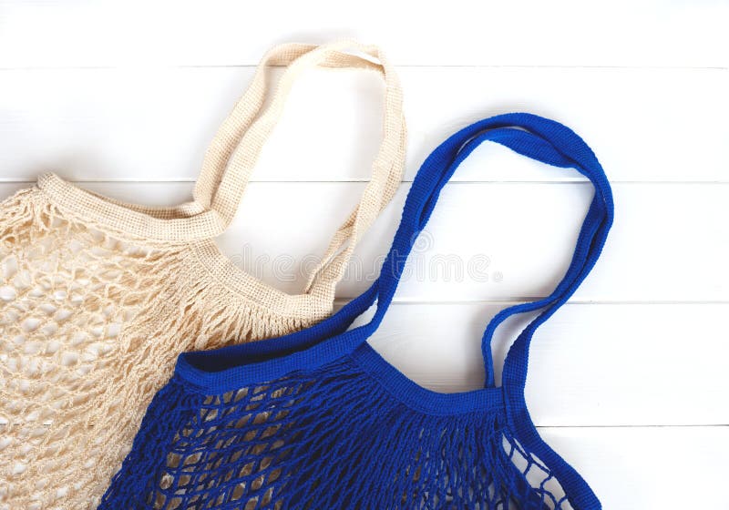 Empty Blue and Beige Net Bags on Wooden Background Stock Image - Image ...