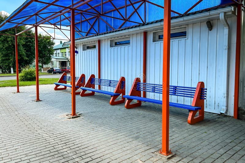 Empty Blue Bus Stop in City. Stock Image - Image of design, road: 250835019