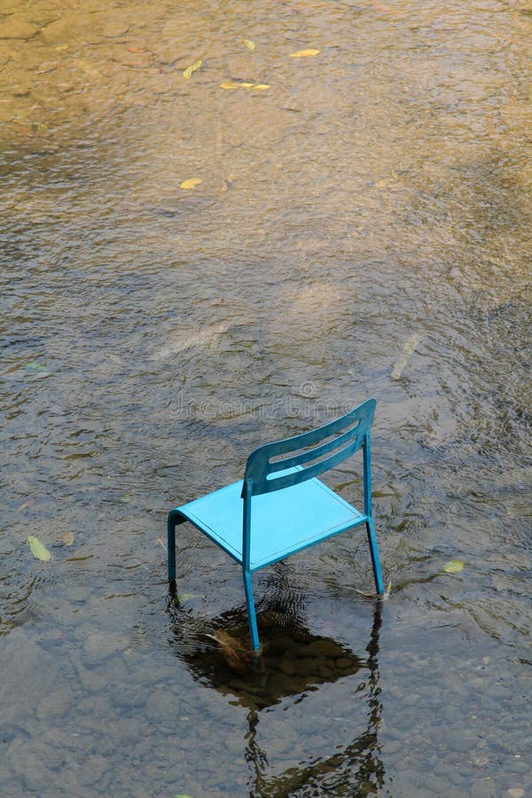 A Chair Put in the Stream Waterfall Stock Image - Image of metal ...