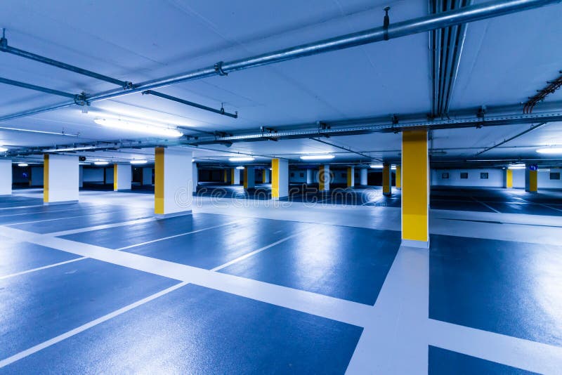 Empty Blue Parking Garage with Yellow Columns Stock Photo - Image of ...