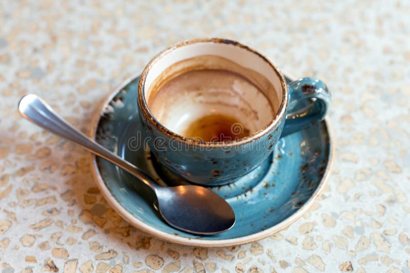 Almost Empty Blue Modern Coffee Cup on Granite Table Background. Stock ...