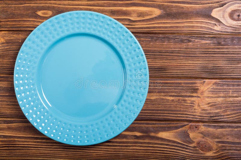 Empty Blue Plate on Wooden Table Top View Background Stock Photo ...