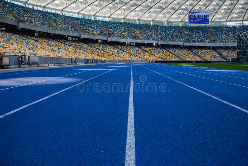 Empty Blue Running Track at the Olympic Stadium Stock Image - Image of ...