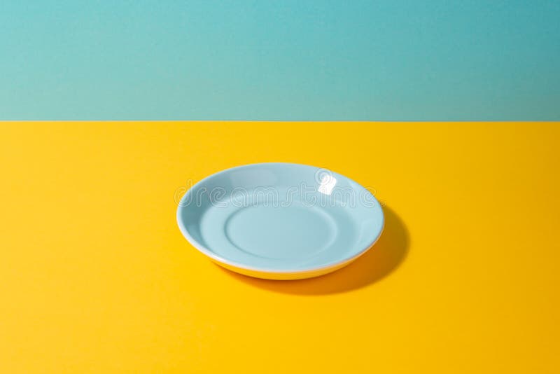 Empty Blue Tea Plate on Yellow Background Stock Image - Image of empty ...